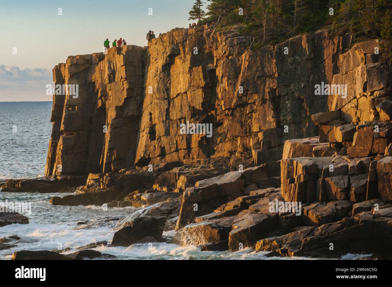 Rock climbers preparing to rappel down Otter Cliffs in Acadia National ...