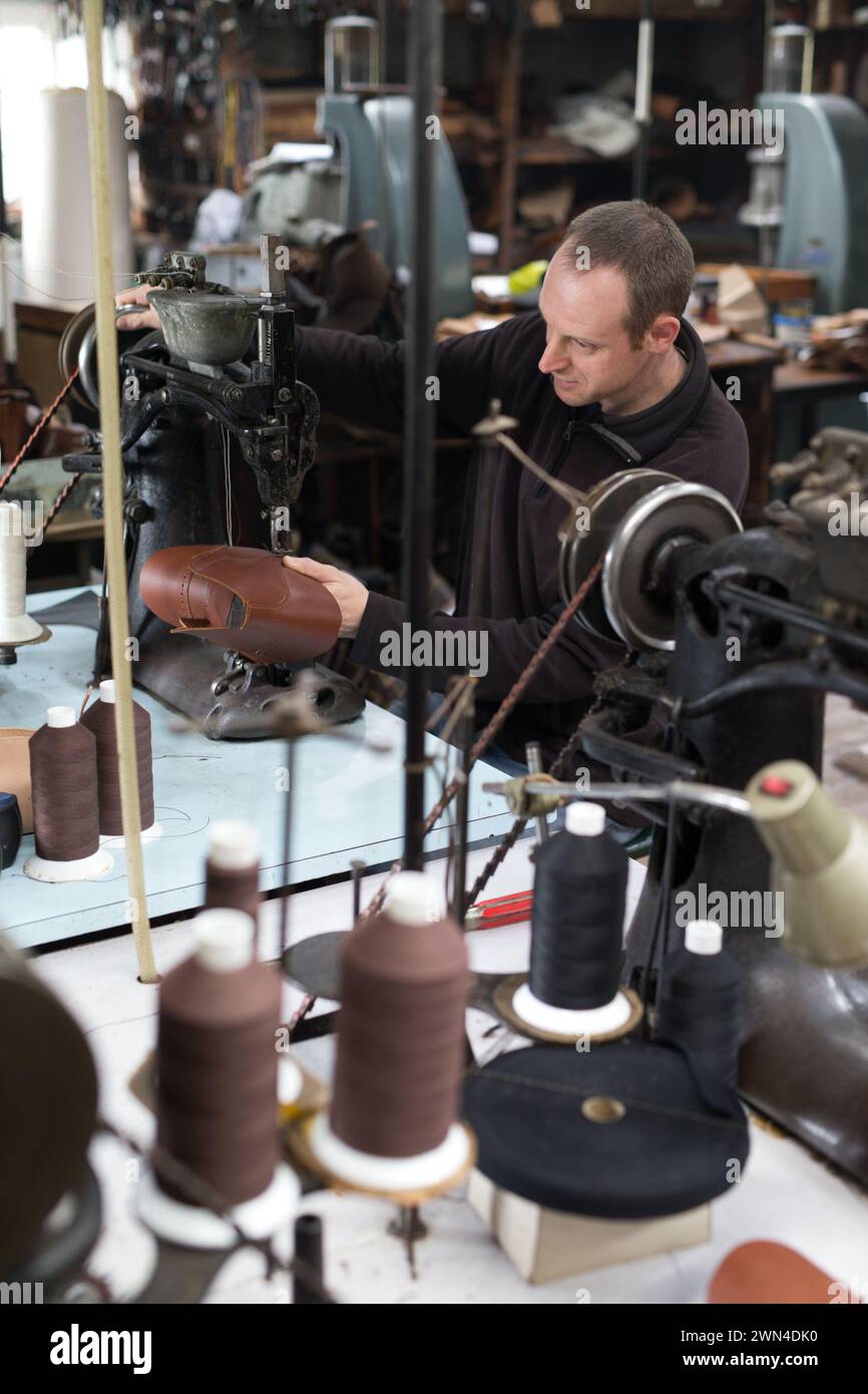 01/05/16 Phil Ashton uses a ancient sewing machine to stitch a boot ...