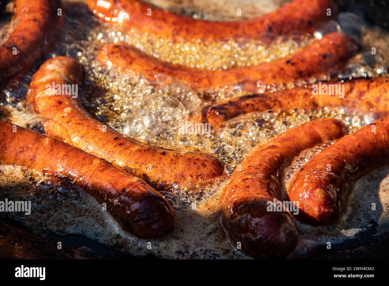 Street Food cooking on big frying pan, tasty home made sausages on ...