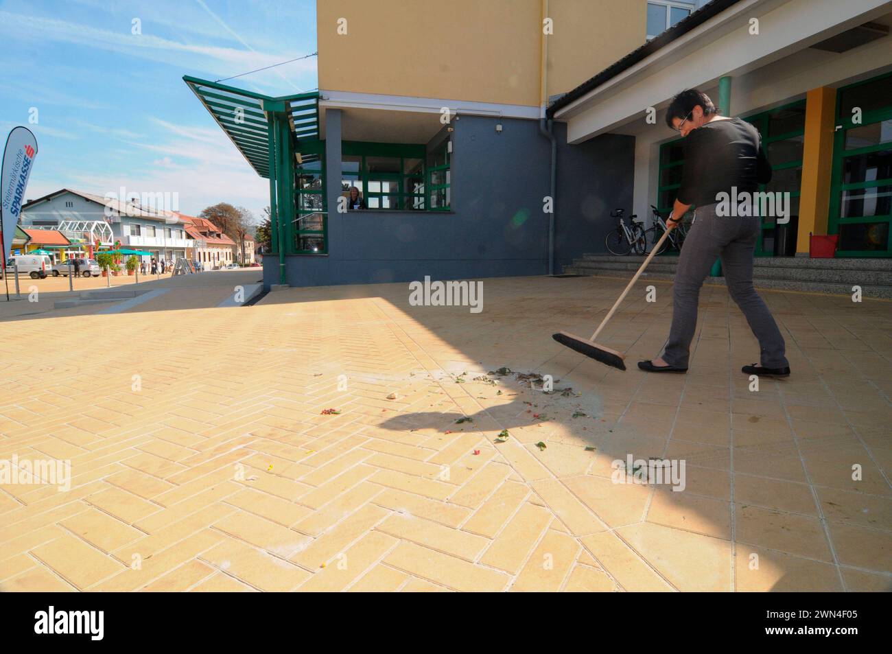floor cleaning with a broom, sweeping away the dirt and dust floor ...
