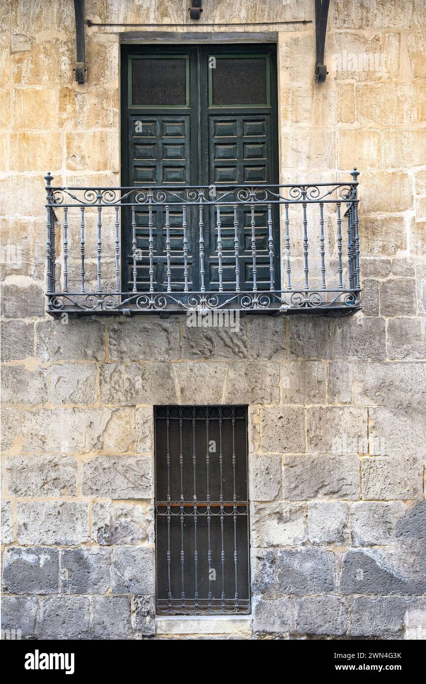 Windows and balcony in medieval stone wall. City Hall building ...
