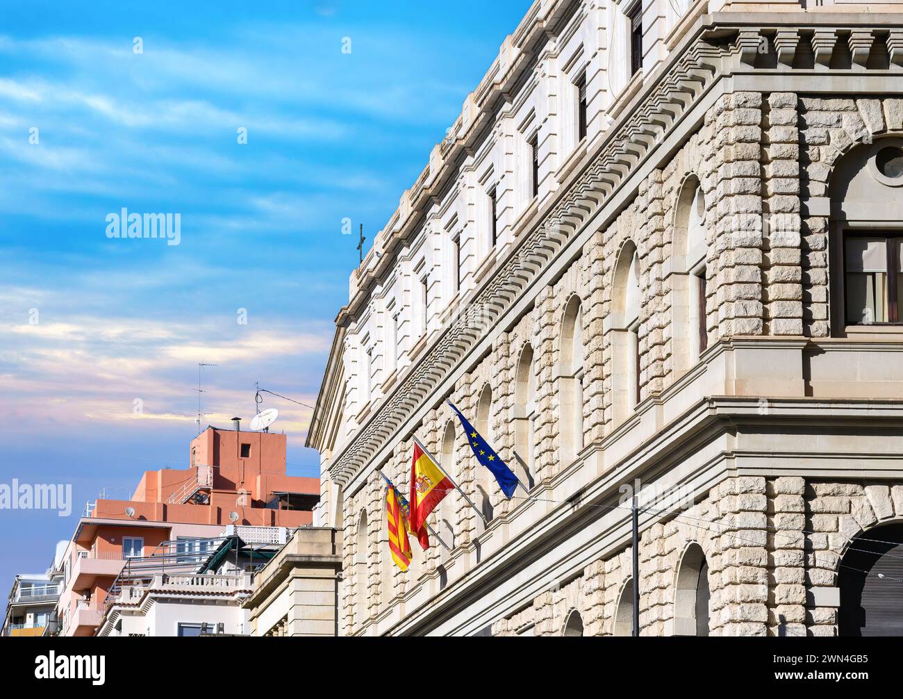 Three flags in the facade of a government building in Alicante, Spain ...