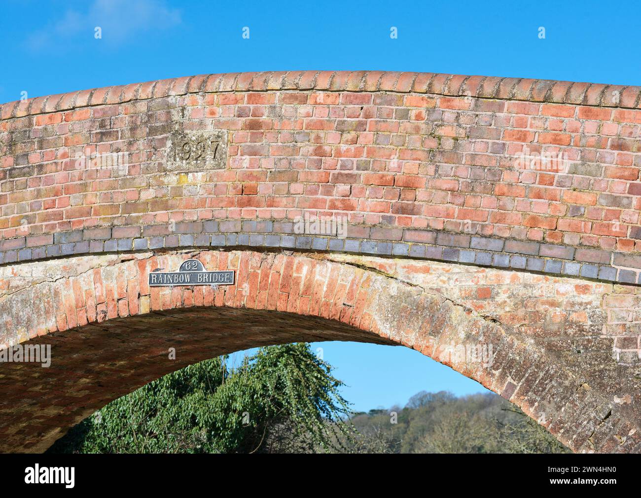 The rainbow brick bridge over the Grand Union canal at the bottom of ...