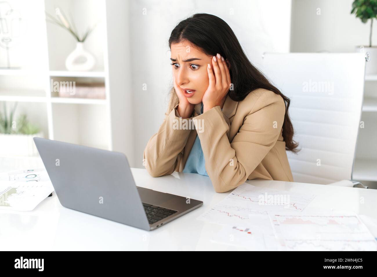 Worried woman investor laptop hi-res stock photography and images - Alamy