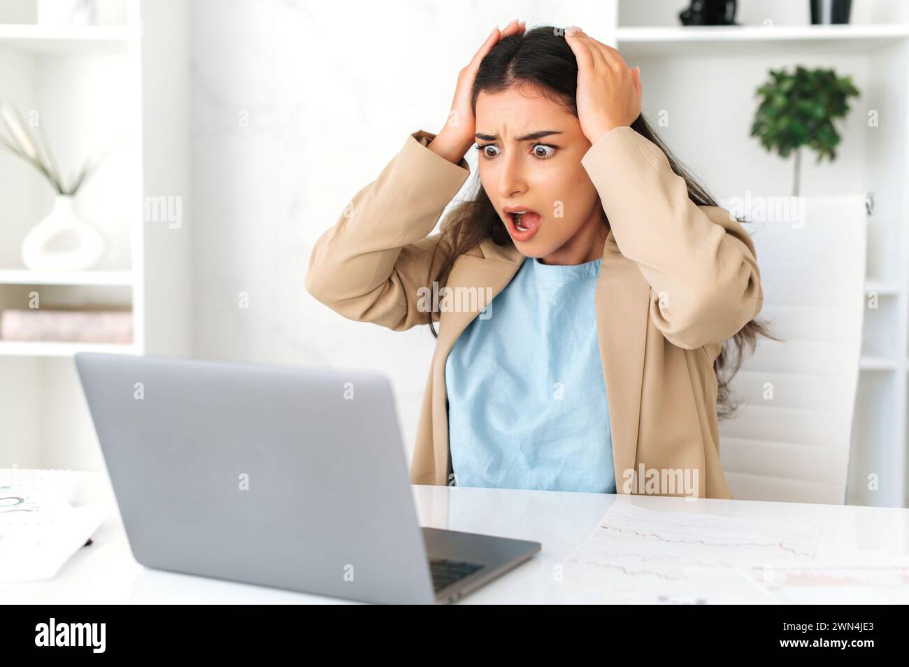 Worried woman investor laptop hi-res stock photography and images - Alamy