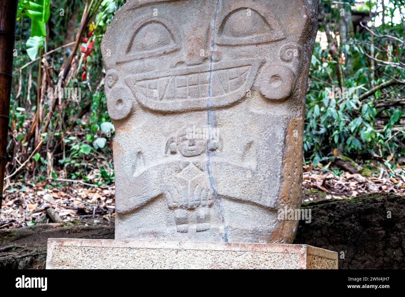 Ancient statue holding a baby in San Agustin, Colombia Stock Photo - Alamy