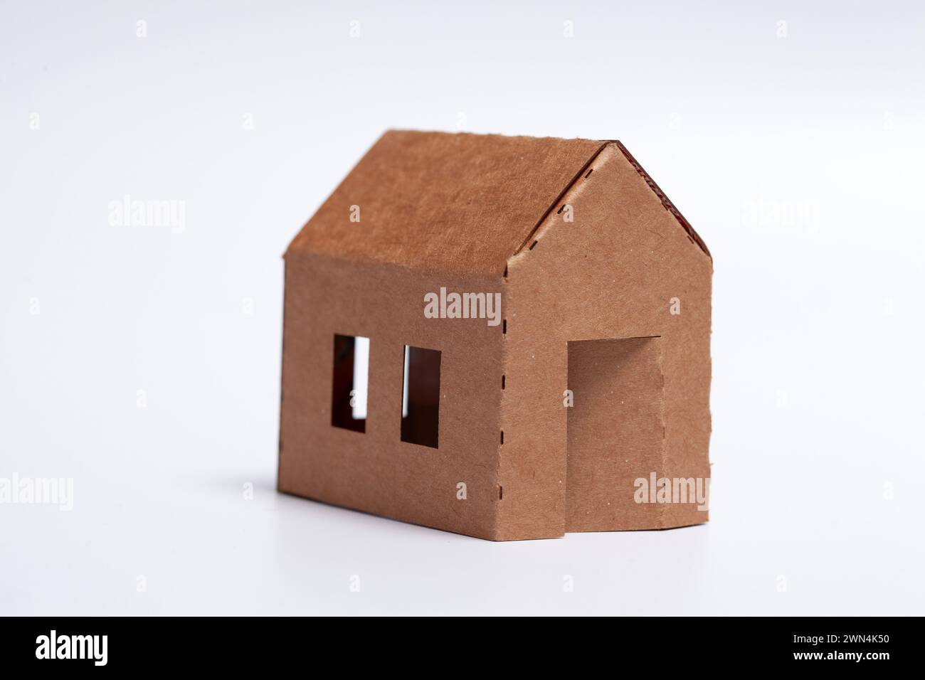 simple DIY family home - cardboard model on white background Stock ...