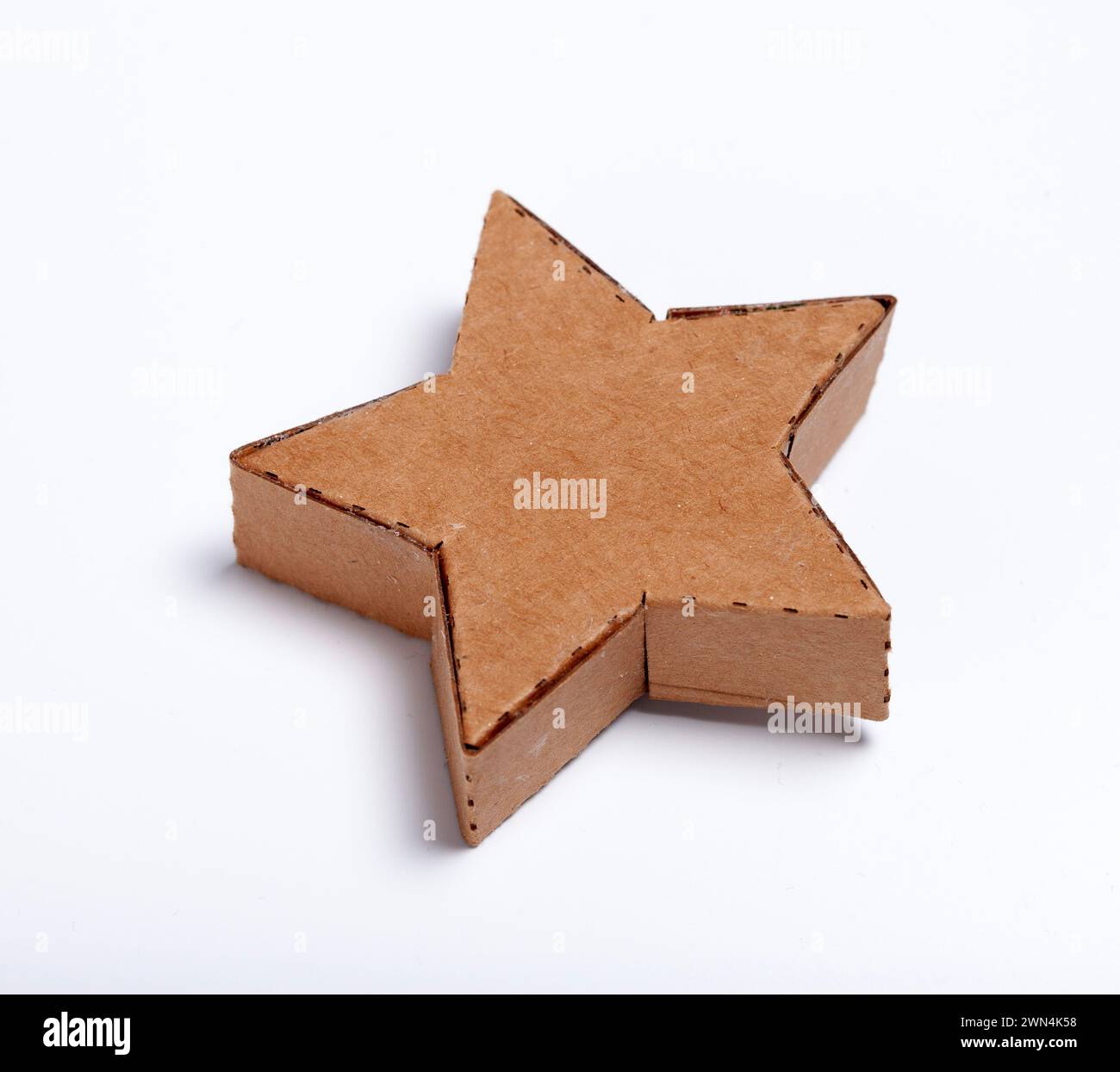 cardboard star shaped box on white background Stock Photo - Alamy