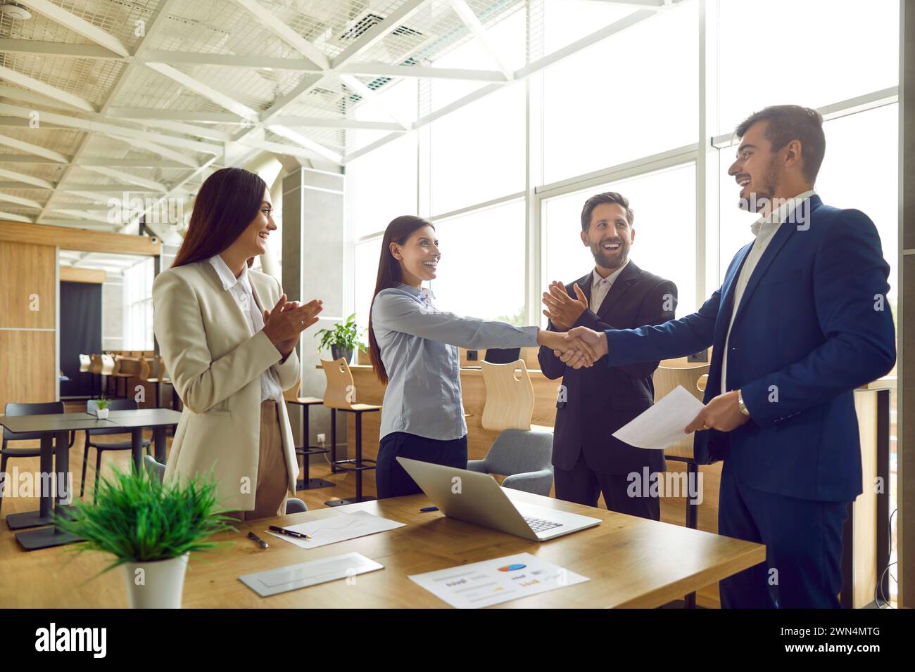 Business Professionals in Office Exchange Handshake Stock Photo - Alamy