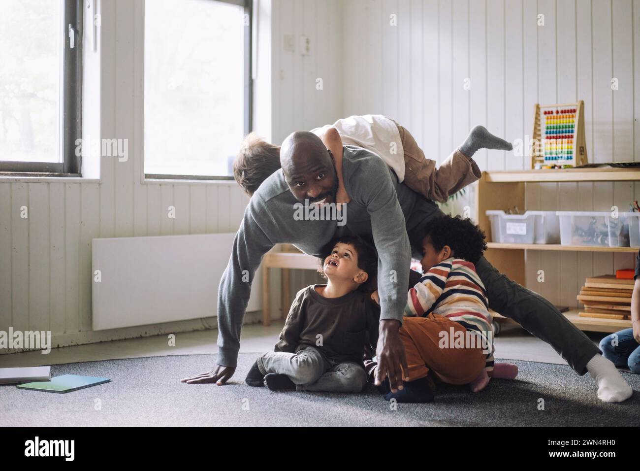 Group school children playing classroom hi-res stock photography and ...