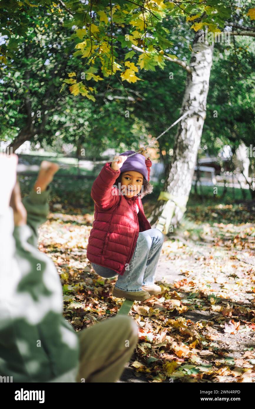 Child hanging rope hi-res stock photography and images - Alamy