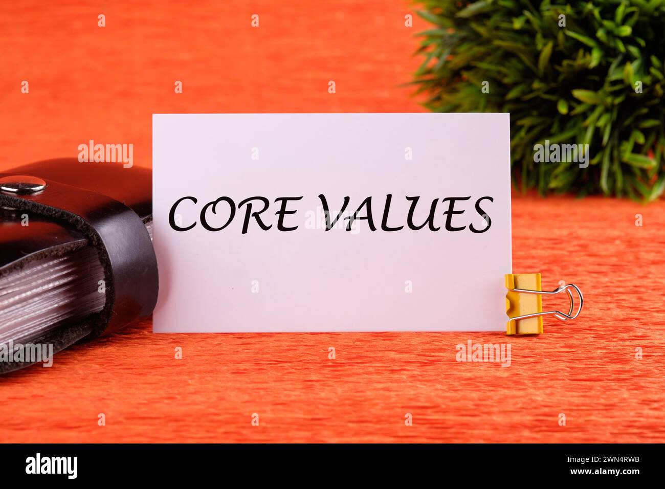 CORE VALUES word written on a white card near the business card holder ...