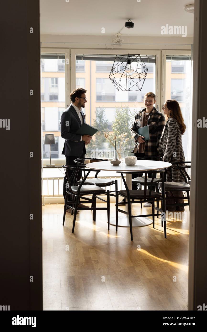 Businessman real estate agent discussing hi-res stock photography and ...