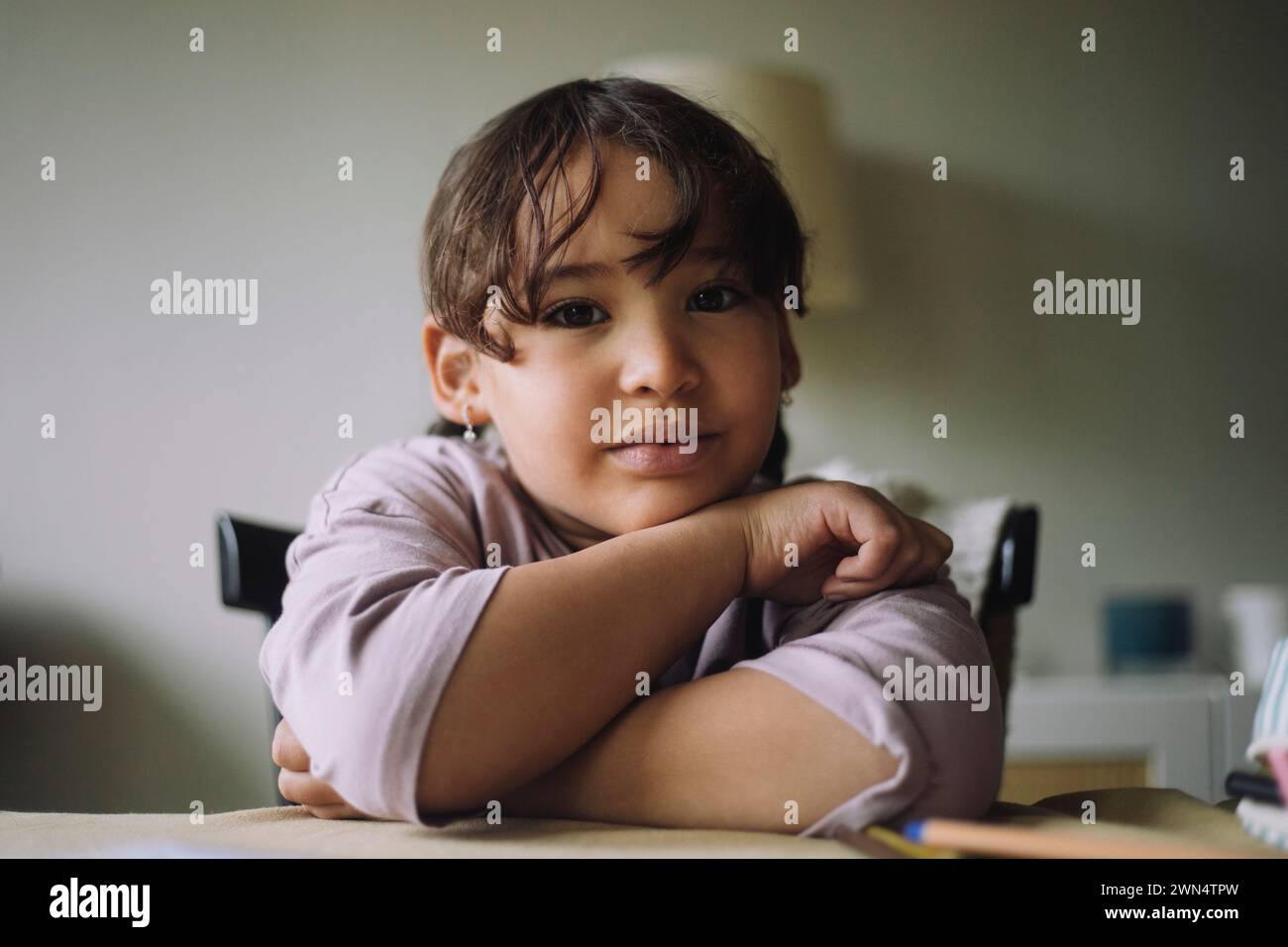 Girl resting head on table hi-res stock photography and images - Alamy