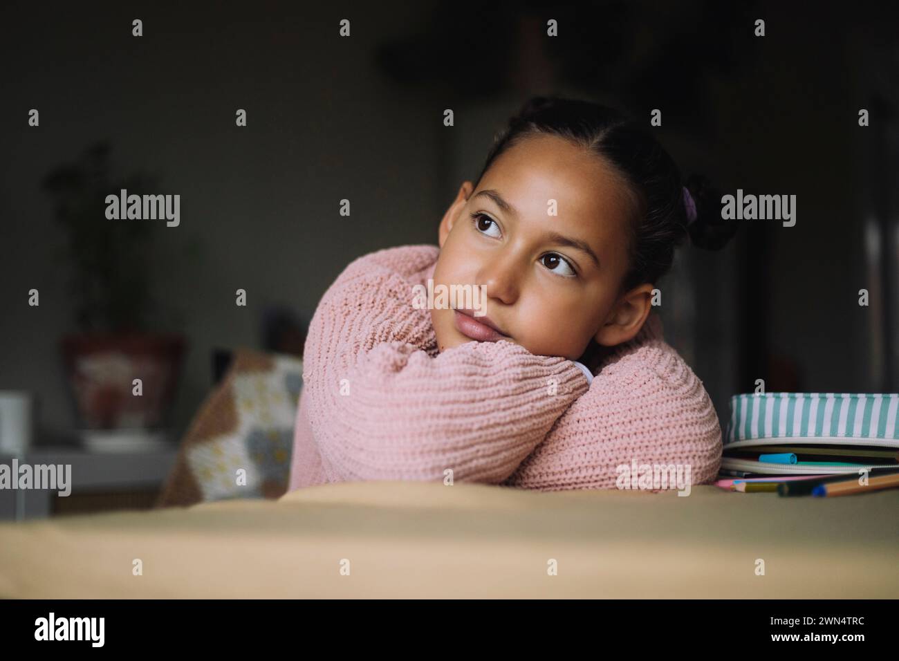 Head resting on arms hi-res stock photography and images - Alamy