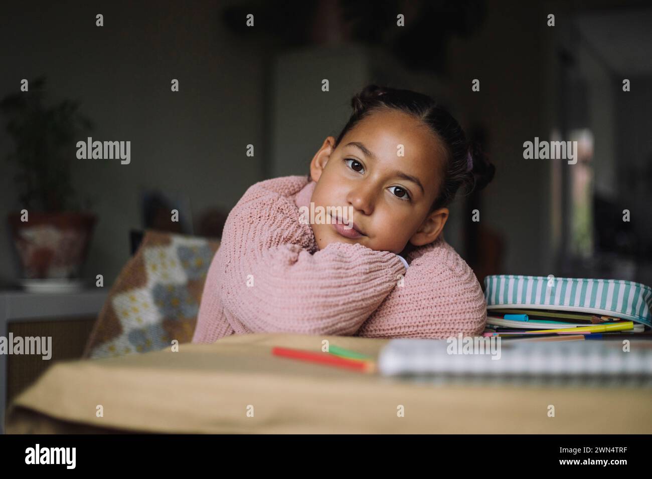 Head resting on arms hi-res stock photography and images - Alamy