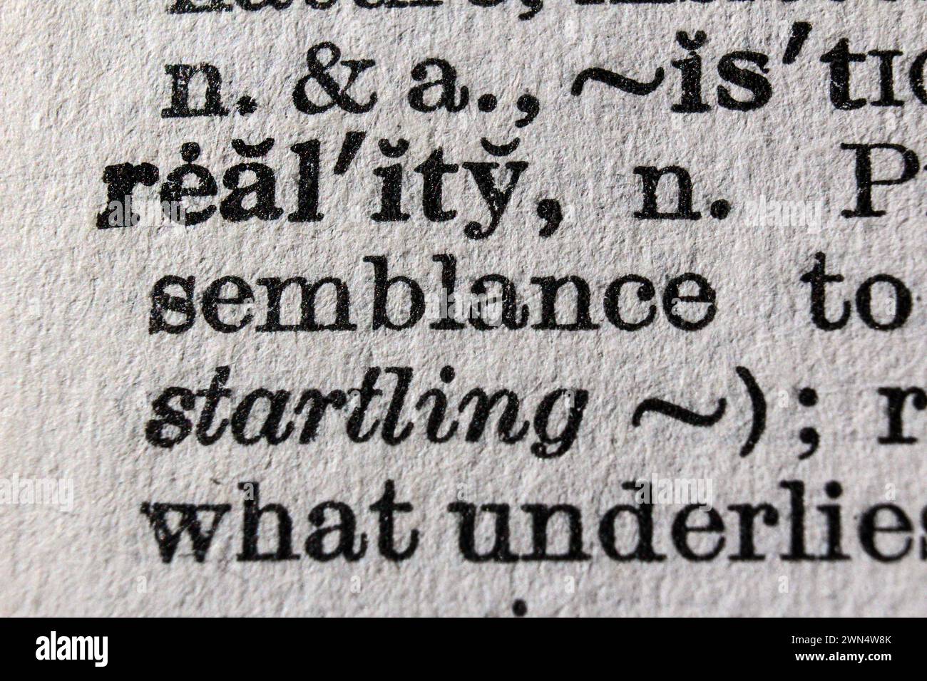 Word reality on dictionary page, macro close-up Stock Photo - Alamy
