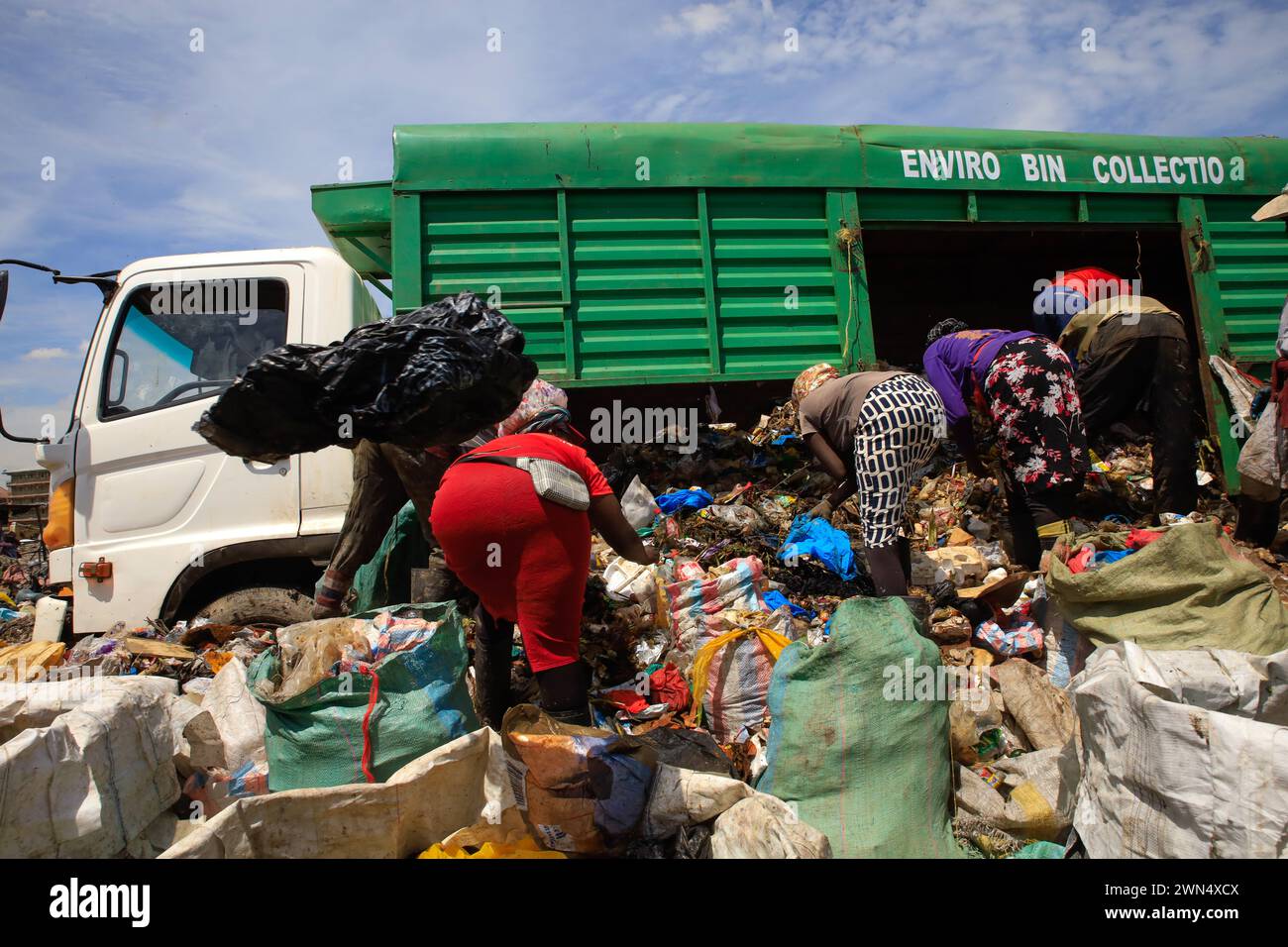 Nairobi, Kenya. 28th Feb, 2024. Waste collectors offloading waste ...