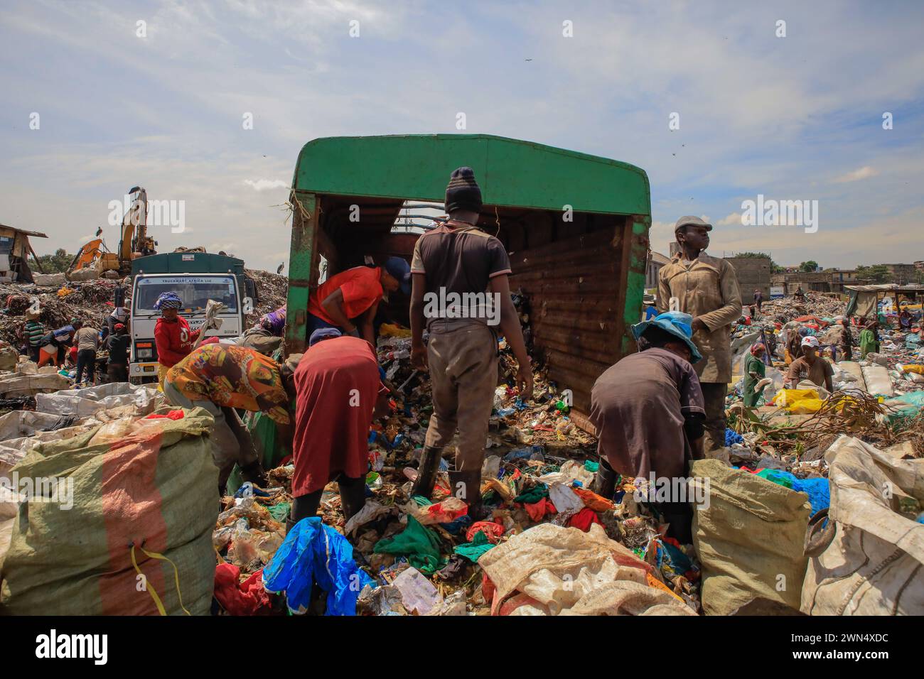 Nairobi, Kenya. 28th Feb, 2024. Waste collectors offloading waste ...