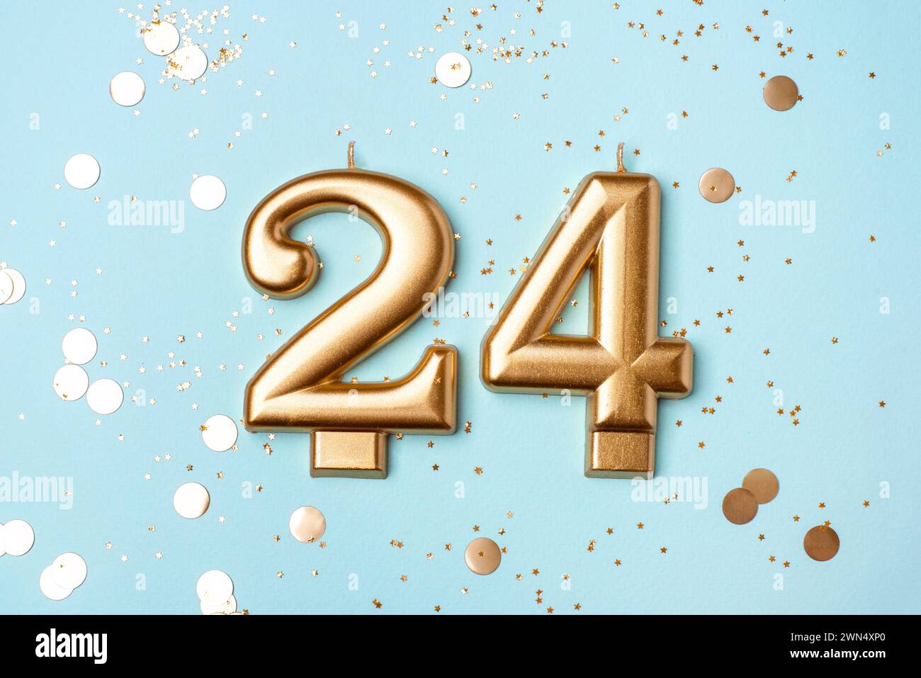 24 years celebration. Greeting banner. Gold candles in the form of ...
