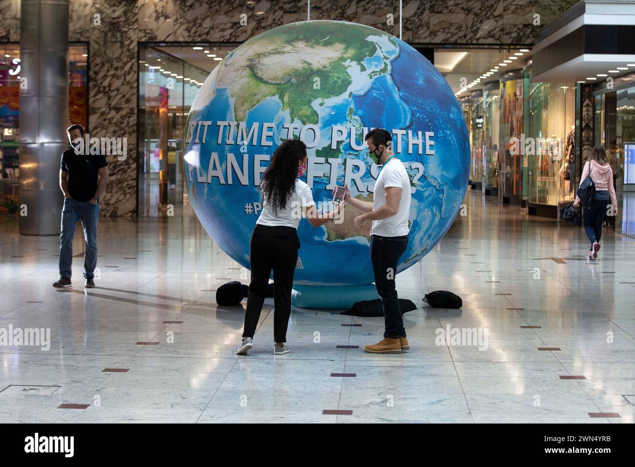 04/06/21 A giant globe emblazoned with the words: ‘IS IT TIME TO PUT ...