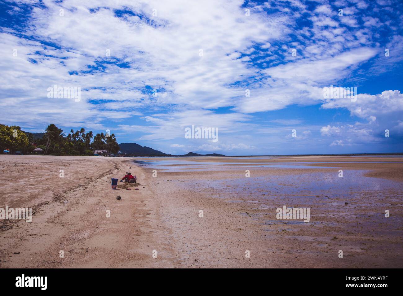The Clam catching of the sea in the west coast of Korea. man wearing a ...