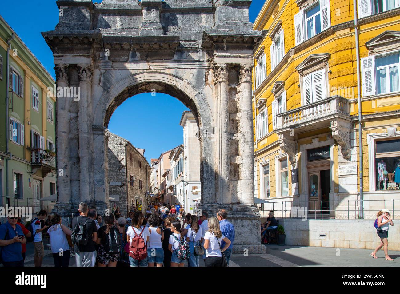 Tourists under the Sergio Arch - Roman triumphal arch of the Sergio ...
