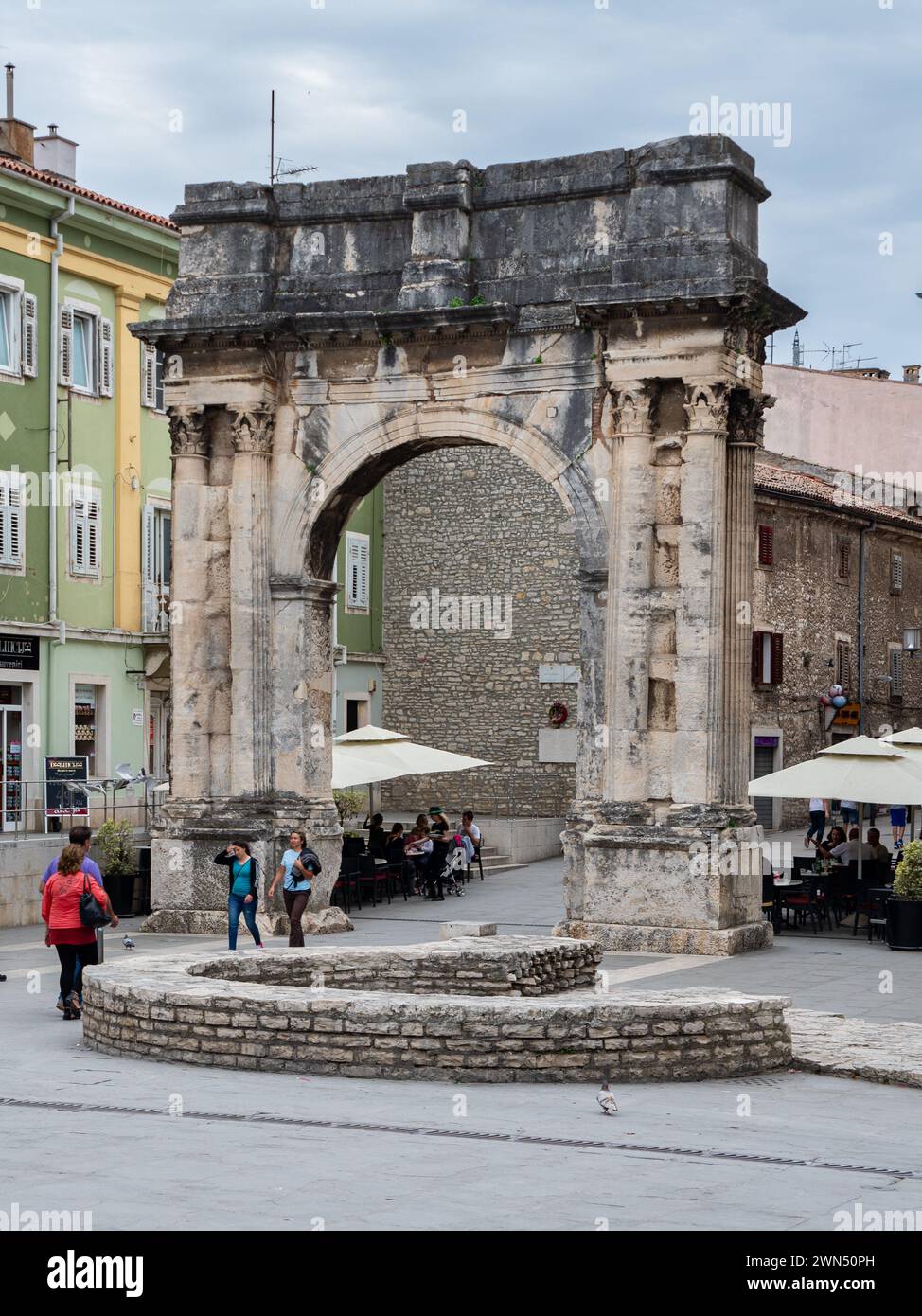 Tourists under the Sergio Arch - Roman triumphal arch of the Sergio ...