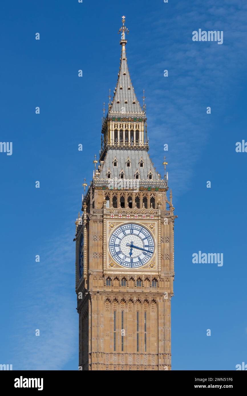Big ben clock tower against blue sky background with light clouds Stock ...