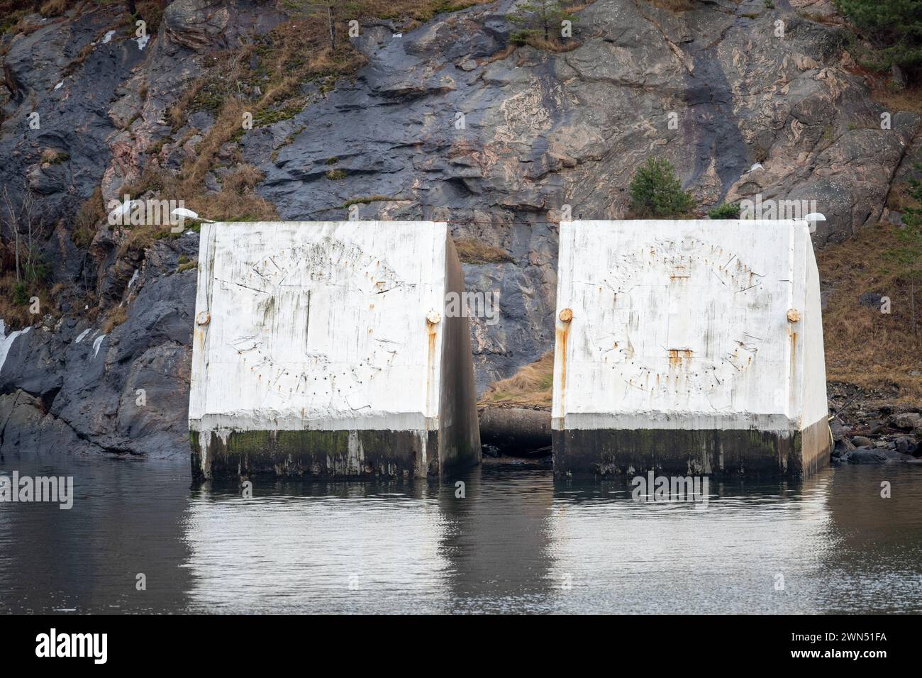 Concrete foundations of old Tjörn bridge by the waterfront. Bolt circle ...