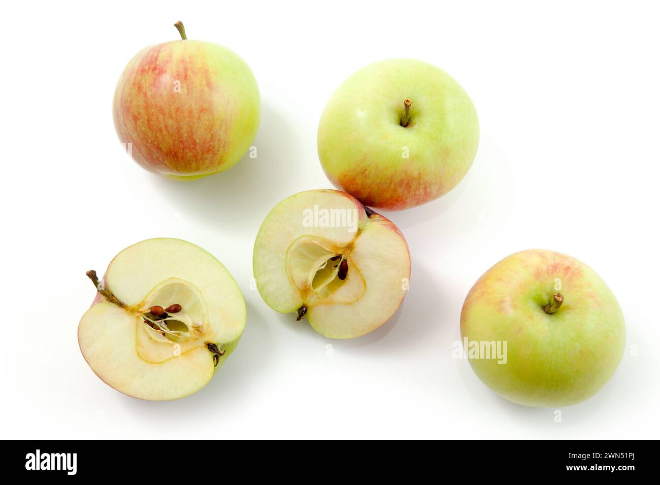 Half and whole of fresh green apples isolated on white background with ...