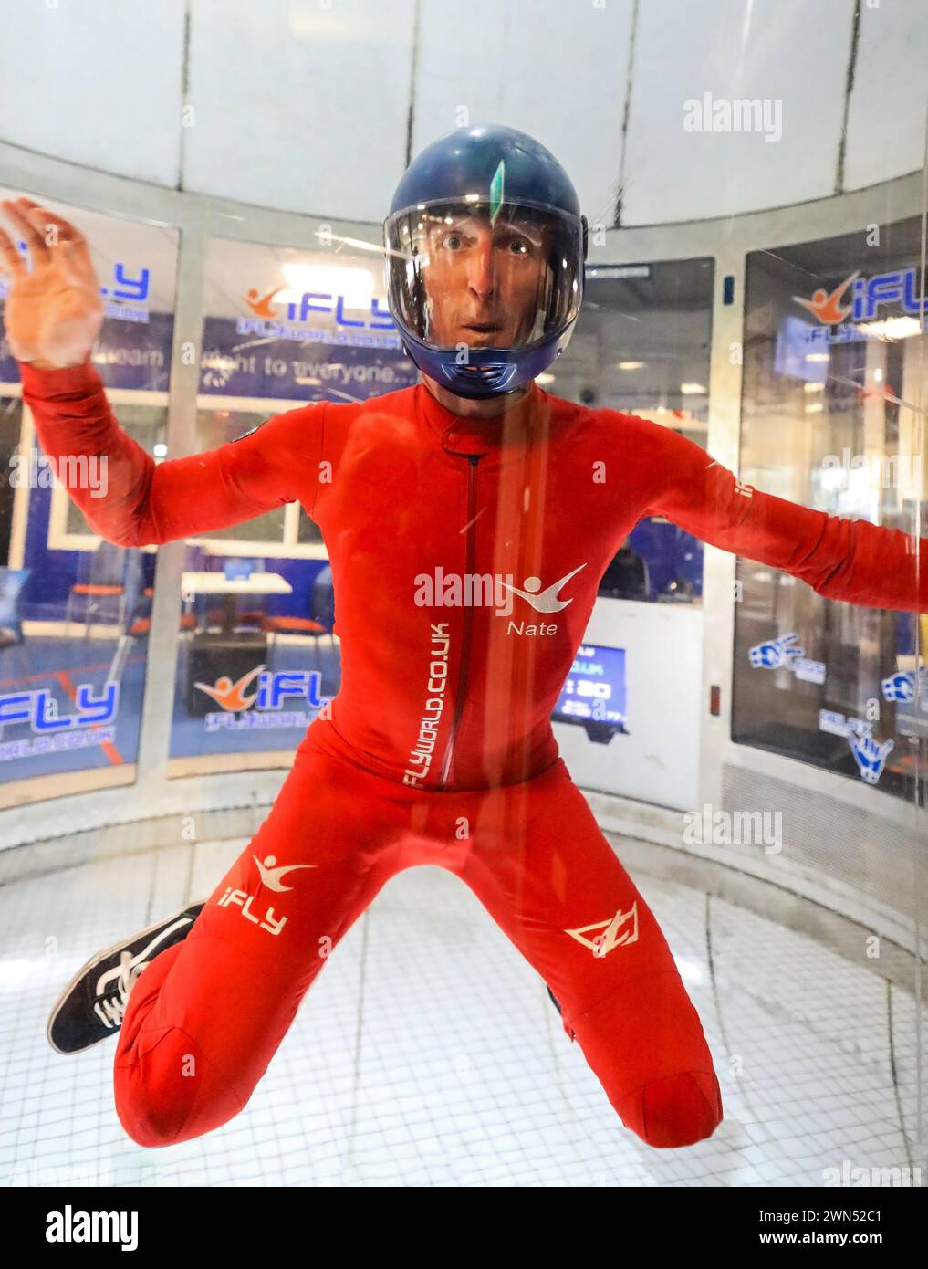 An Indoor skydiving instructor in a wind tunnel at iFly, Manchester ...