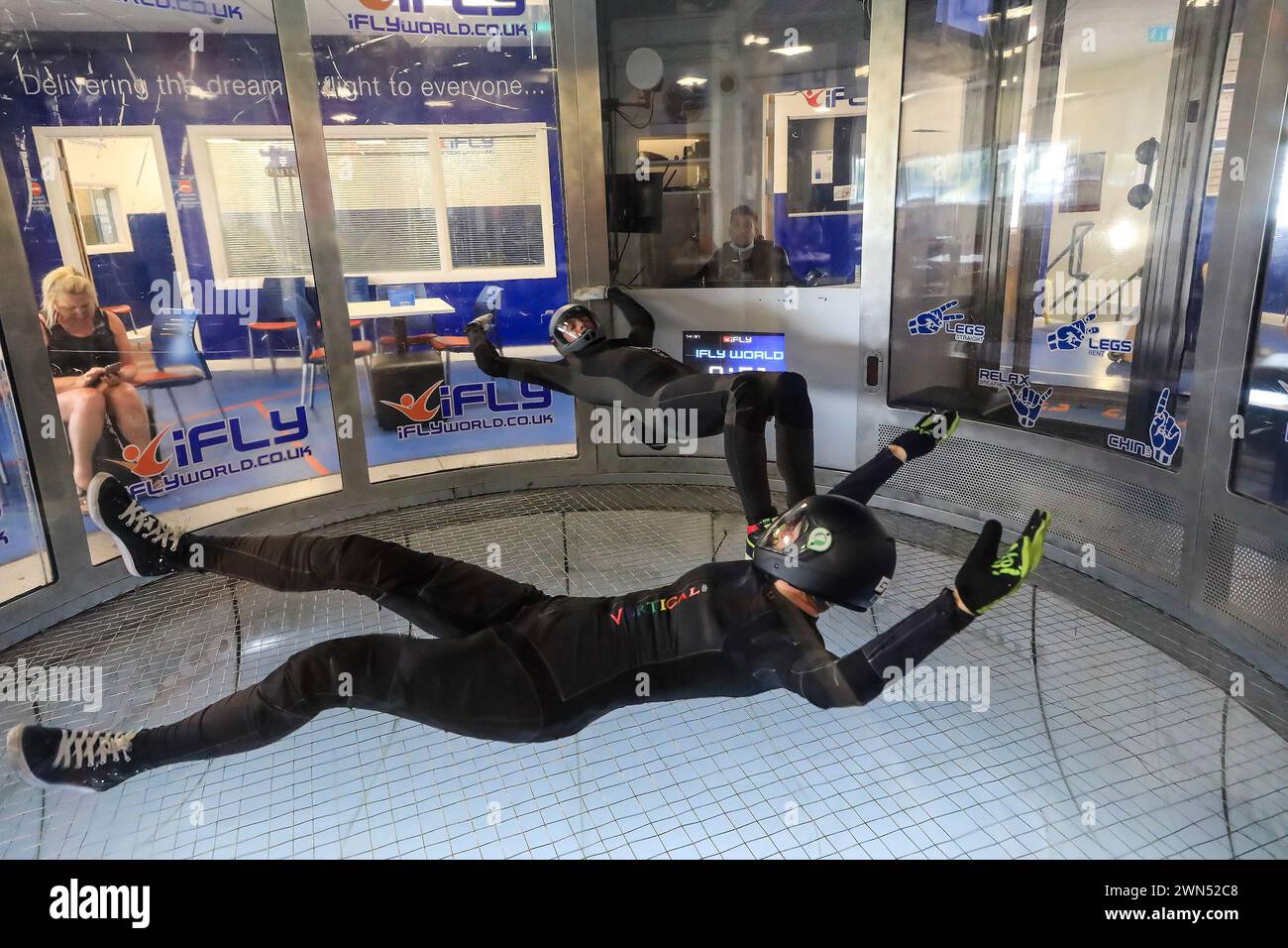 Two people Indoor skydiving in a wind tunnel at iFly, Manchester ...