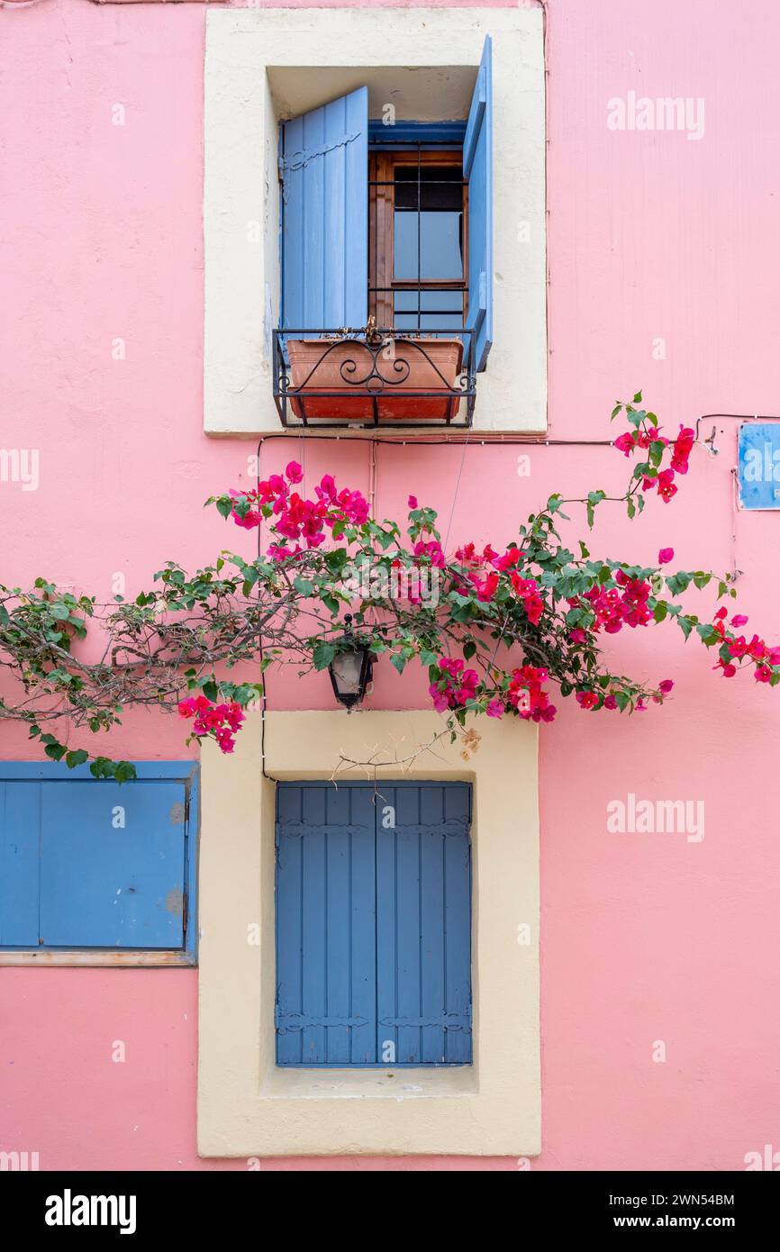 Colours of Greece at Fiscardo village, Kefalonia. Pink walls, pale blue ...