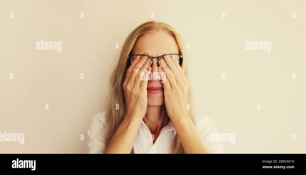 Tired overworked woman employee rubbing her eyes suffering from eye ...