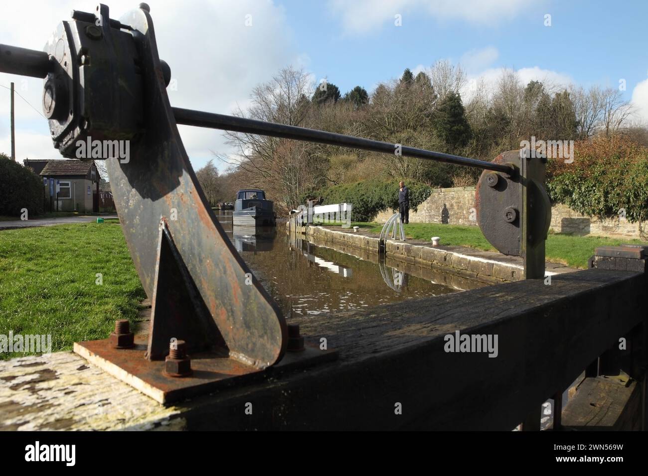 Narrow boat negotiating Higherland Lock, no.32, on the Leeds ...