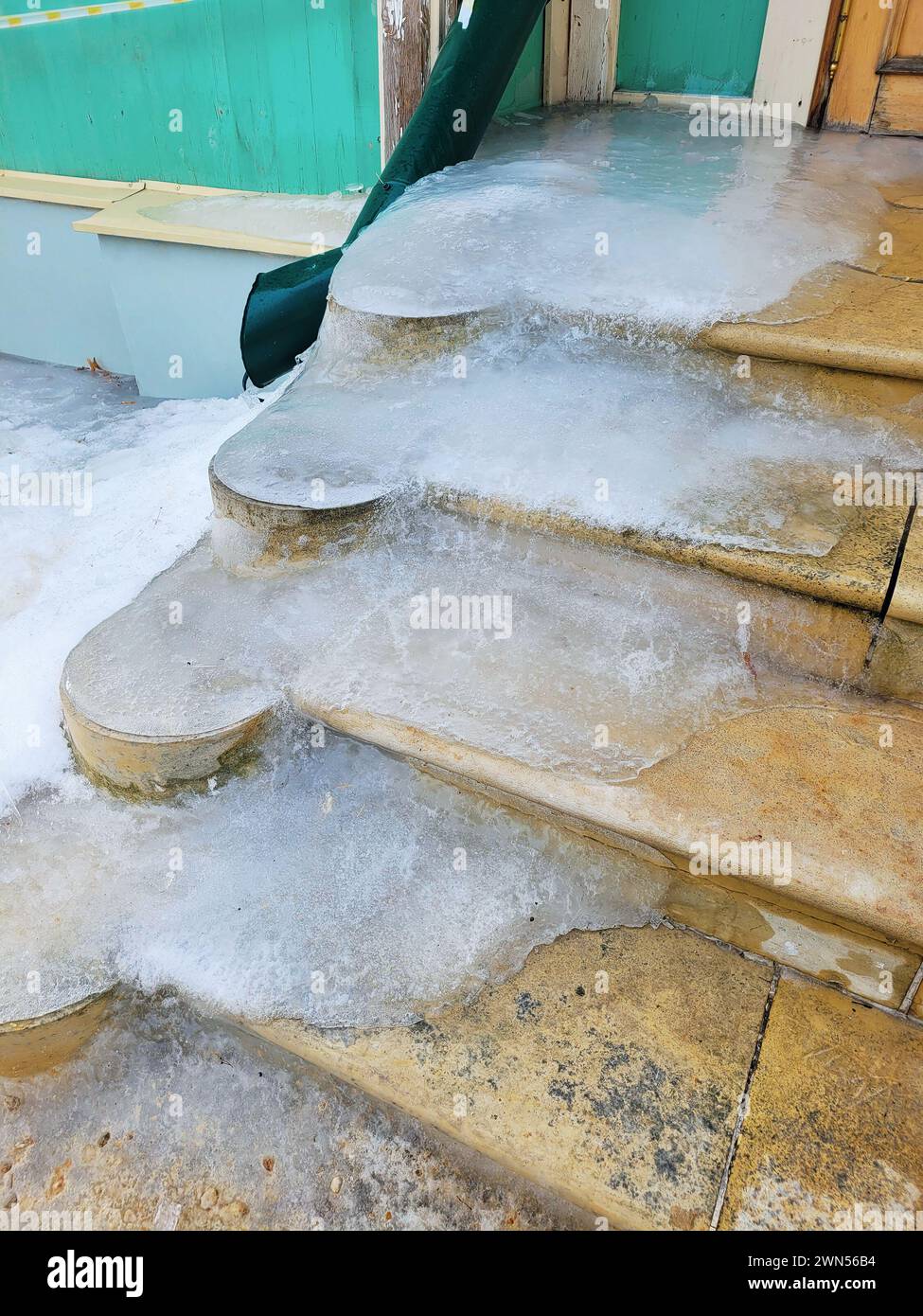 Ice on the steps at the entrance to the building Stock Photo - Alamy