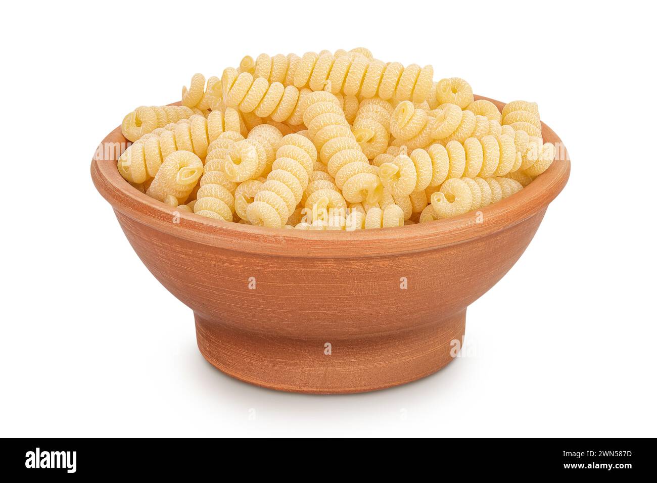 Italian spiral shaped pasta, Fusilli bucati macaroni in ceramic bowl ...