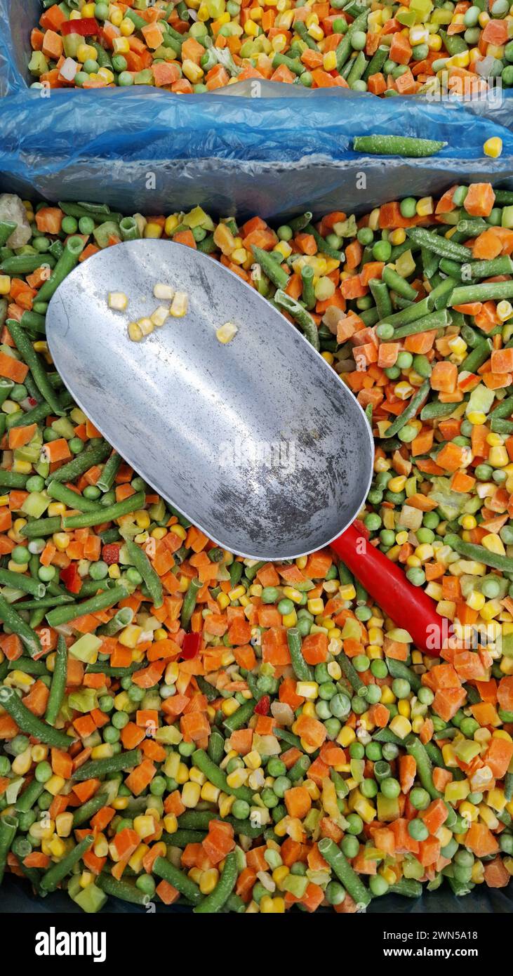 Frozen vegetables in a store, close-up. A mix of vegetables is sold in ...