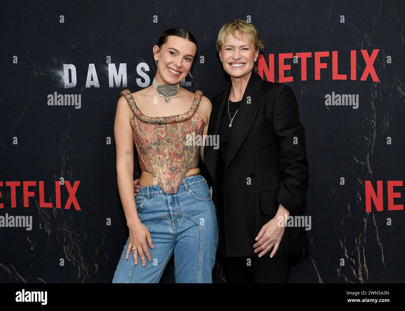 Actors Millie Bobby Brown, left, and Robin Wright pose together at the ...