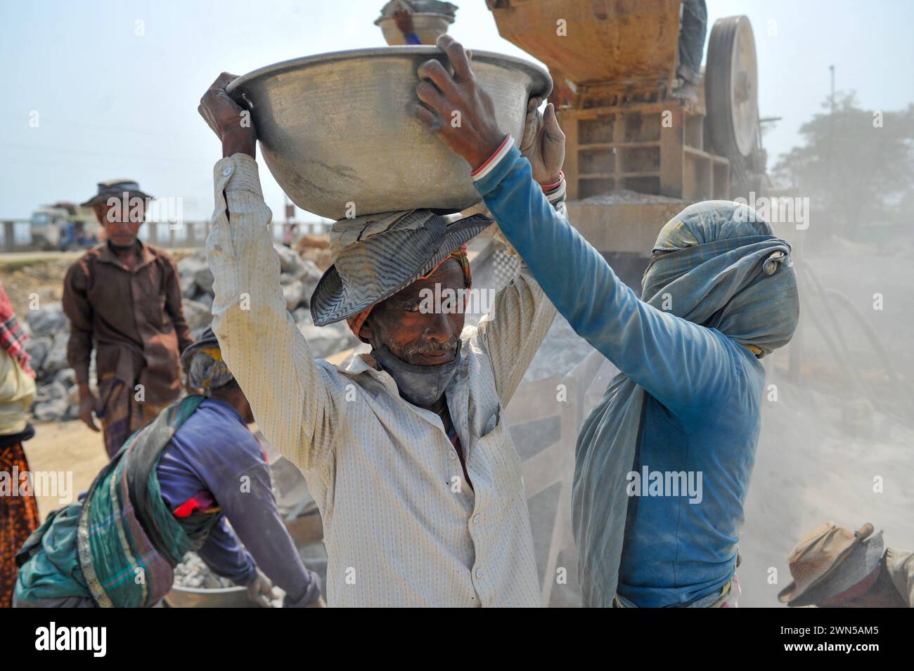 February 29, 2024, Sylhet, Bangladesh: Stone workers carrying ...