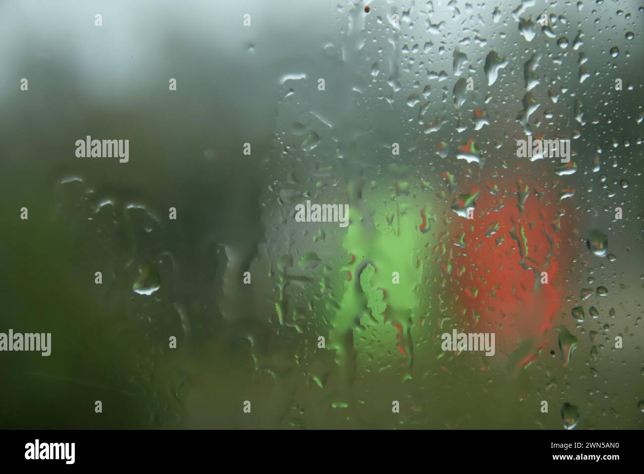 Rain drops on window glasses surface with cloudy background. Natural ...