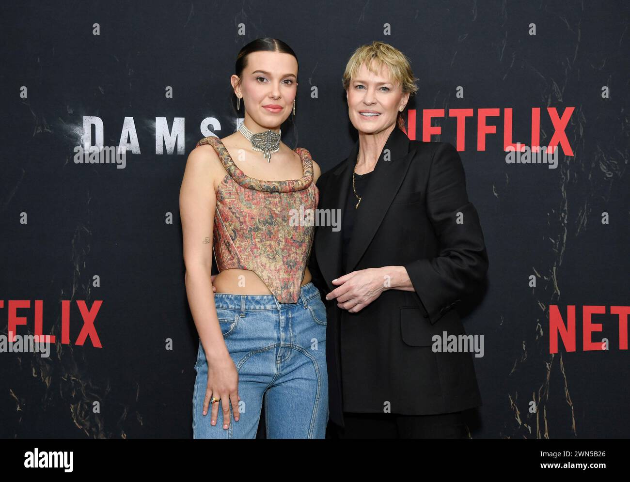 Actors Millie Bobby Brown, left, and Robin Wright pose together at the ...