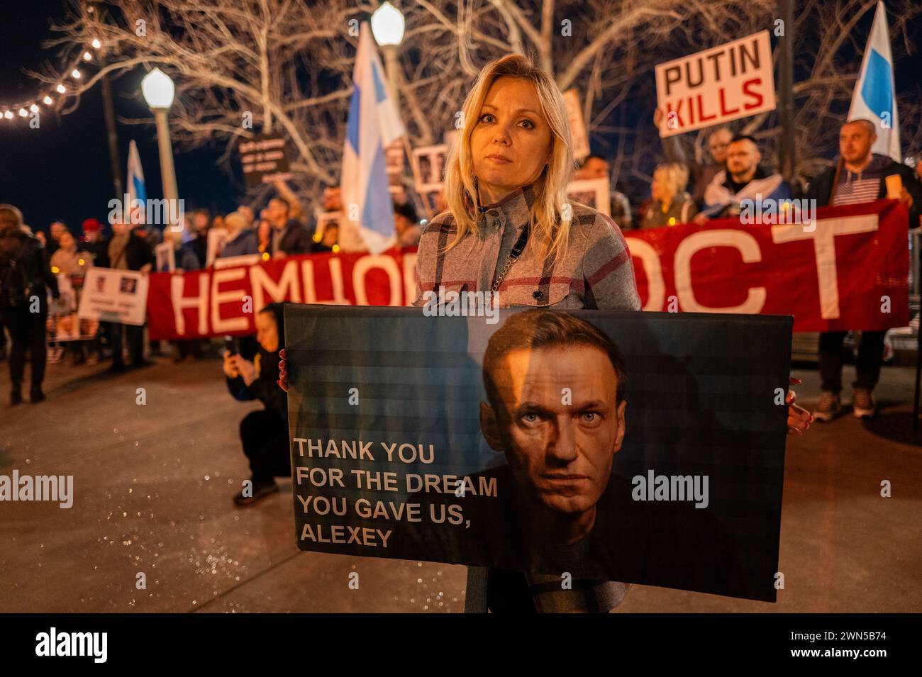 Sacramento, Ca. 27th Feb, 2024. Iana Trotsiuk holds a sign in memory of ...