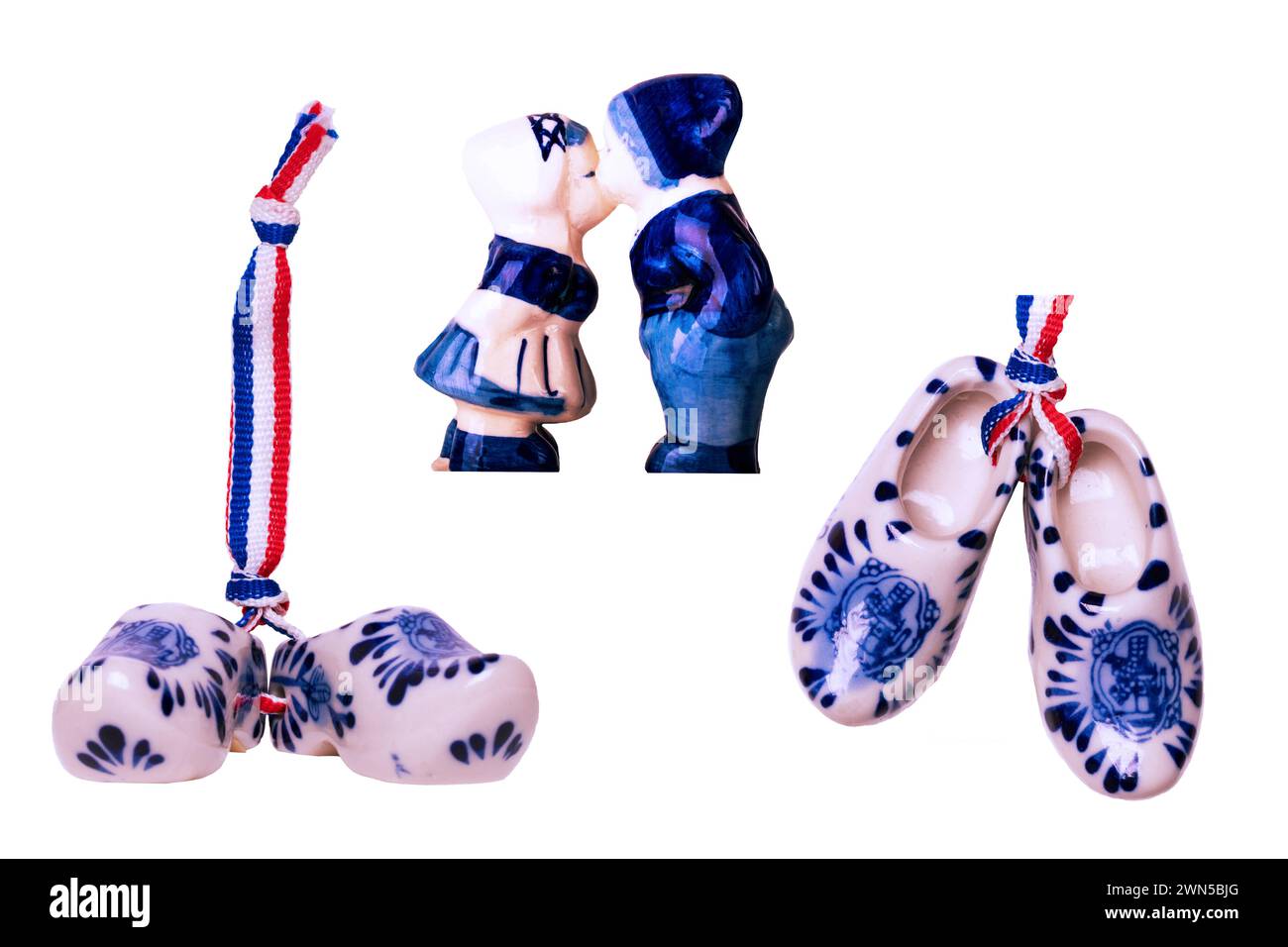 Traditional dutch porcelain shoes with a ribbon flag and kissing boy ...