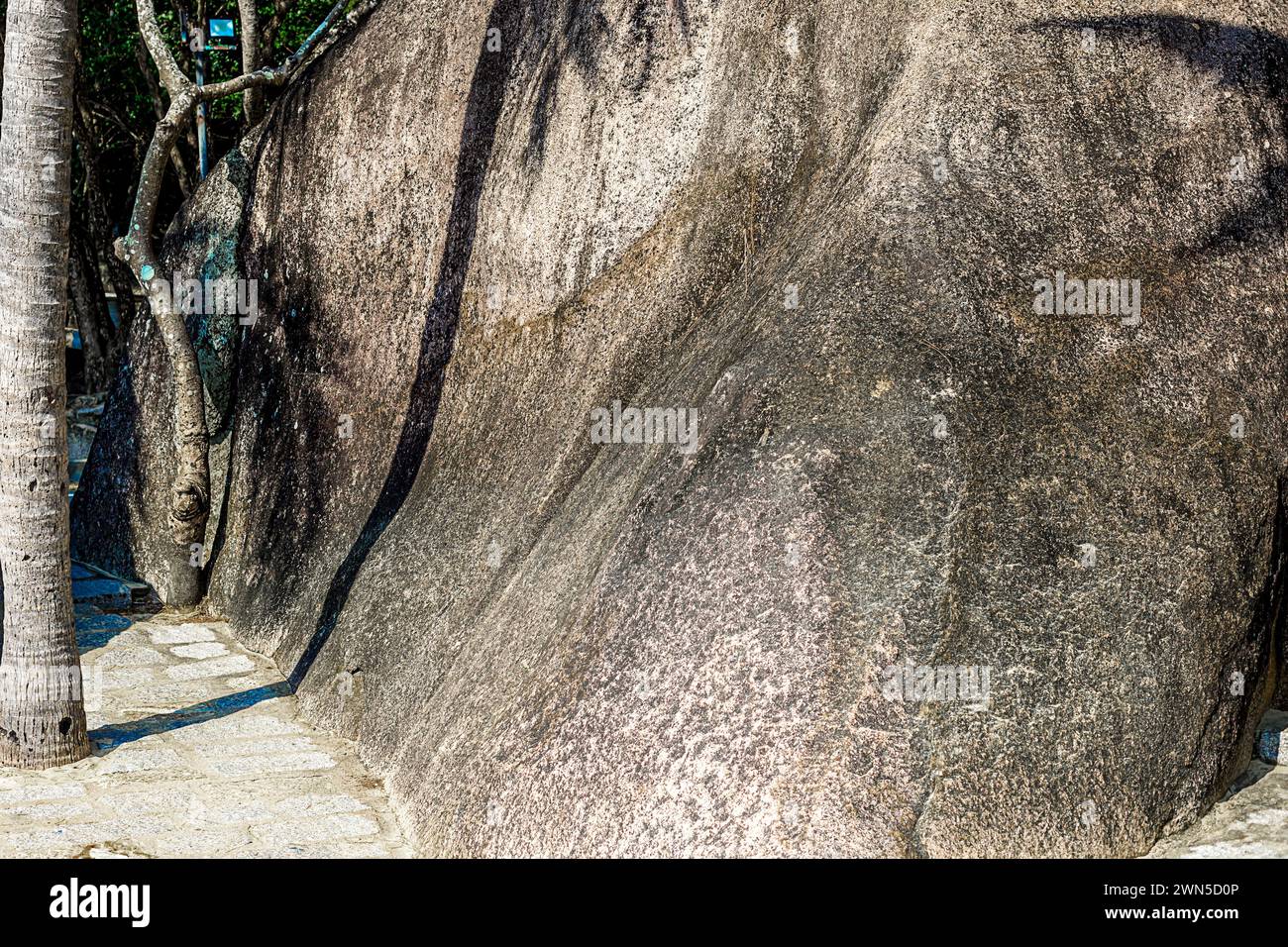 View of the beach with huge rocks. Sanya, China. Park Heavenly Grottoes ...