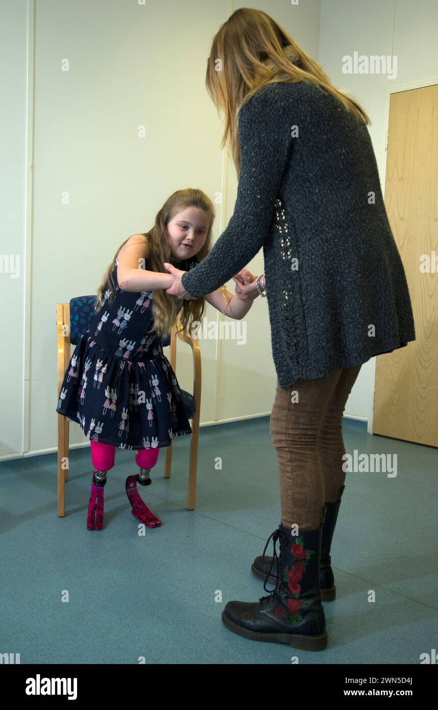 17/12/14 Grace's mum, Vicky (40) helps Grace to her feet wearing her ...