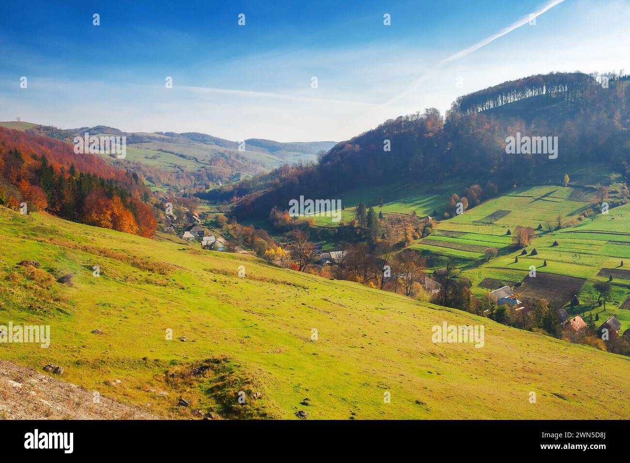 rural landscape of carpathian mountains. beautiful countryside scenery in autumn season with ...