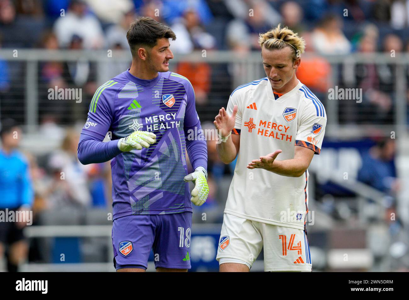 FC Cincinnati goalkeeper Roman Celentano (18) speaks with defender Kipp ...