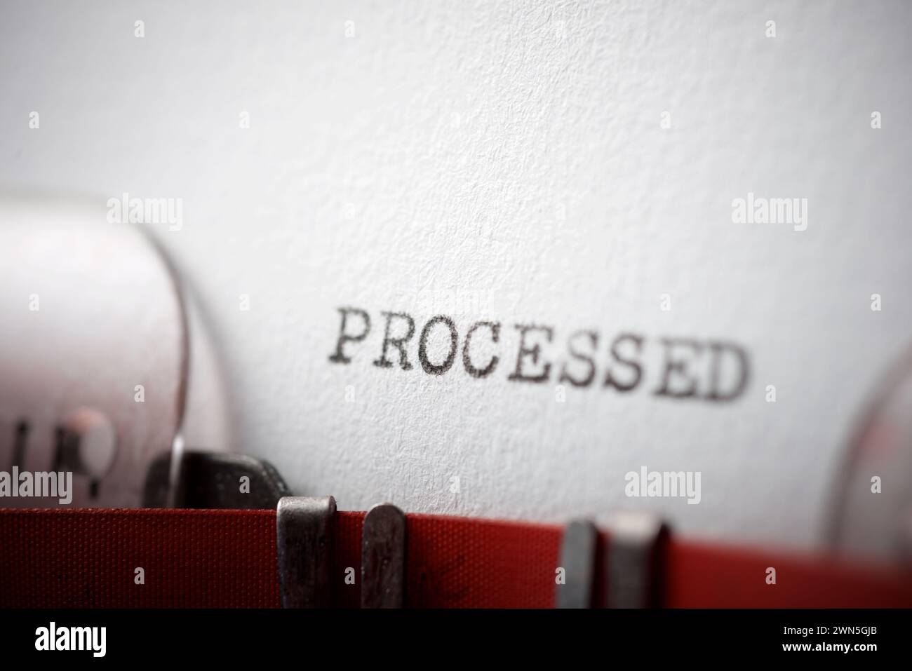 Processed word written with a typewriter Stock Photo - Alamy